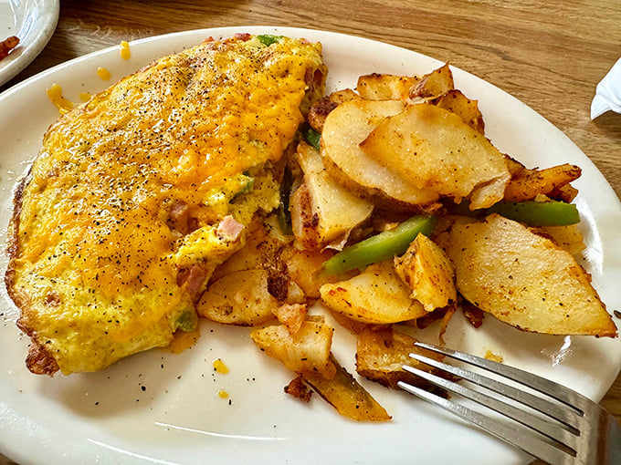 An omelet so perfectly executed it makes you question why you ever attempt to make them at home. Cheese pull for days!