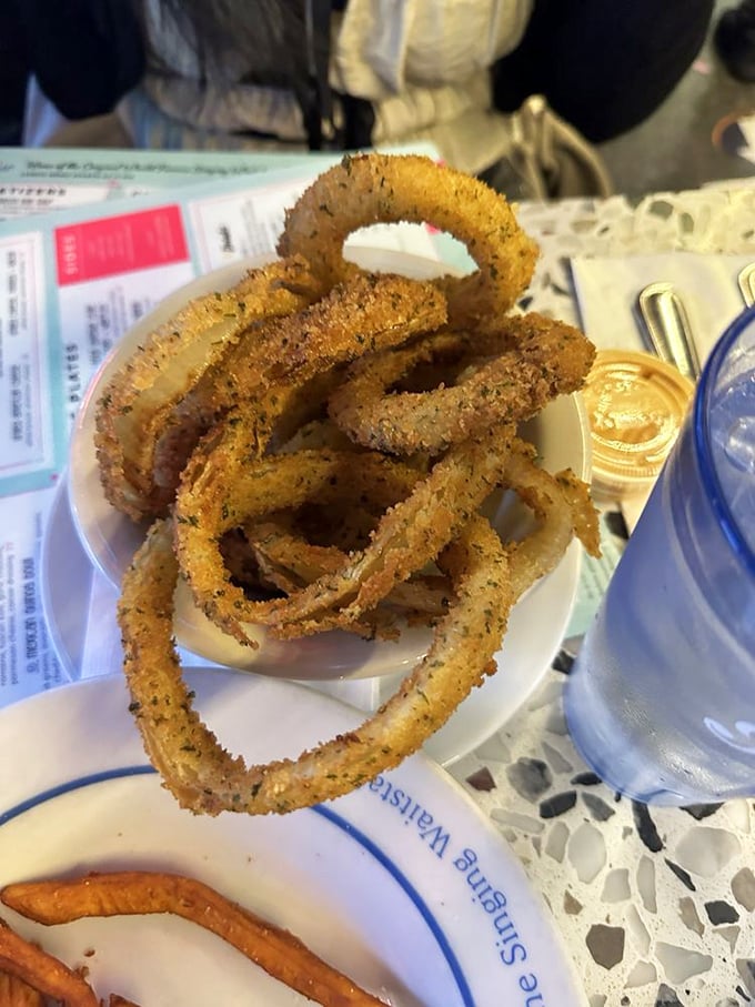 These onion rings aren't just appetizers&mdash;they're golden halos of crispy perfection that deserve their own spotlight moment between musical numbers.