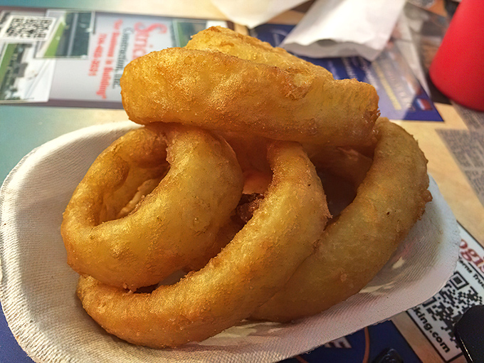 These onion rings achieve the perfect golden ratio of crunch to tenderness. You can almost hear the satisfying crackle with each bite.