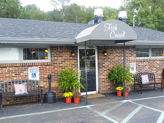 The entrance speaks volumes&mdash;brick facade, potted plants, and a welcoming bench where you can rest before embarking on your seafood adventure.