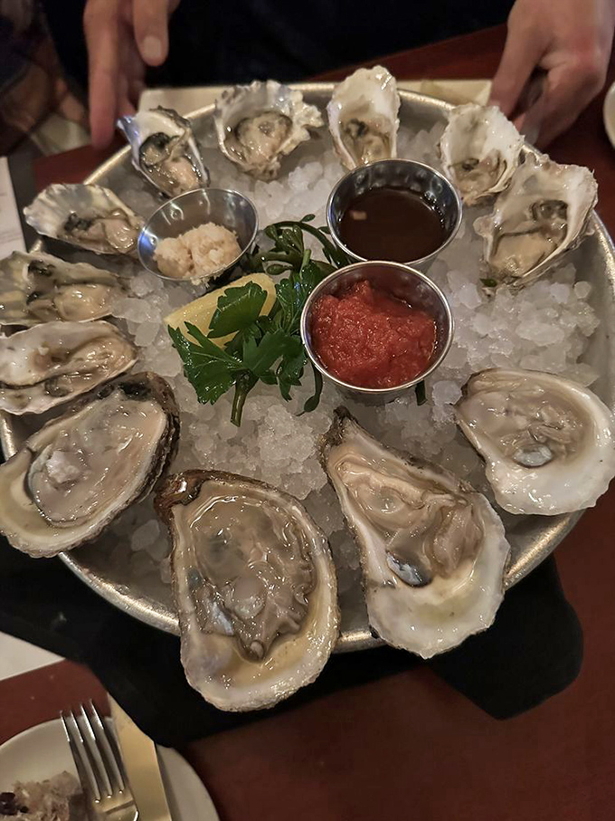 A platter of oysters on ice, arranged like jewels with three dipping sauces &ndash; nature's perfect appetizer awaits your verdict.