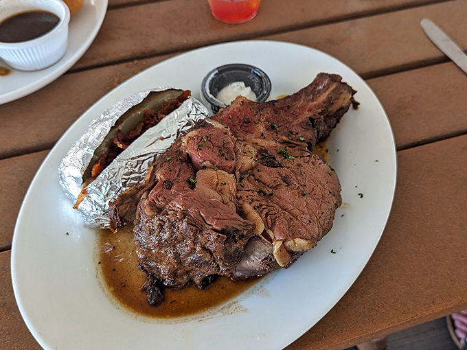 Prime rib that's not just dinner but a destination. The baked potato in foil is like finding an extra present under the Christmas tree.