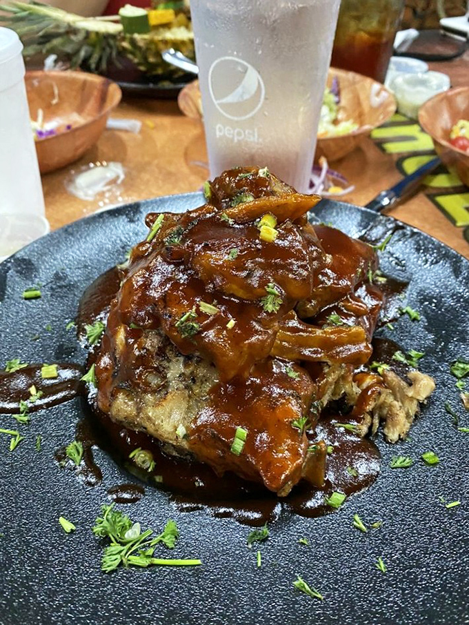 These ribs might make you understand why dinosaurs fought over food. Tender meat glistening with sauce, garnished with green onions&mdash;worth the sticky fingers.