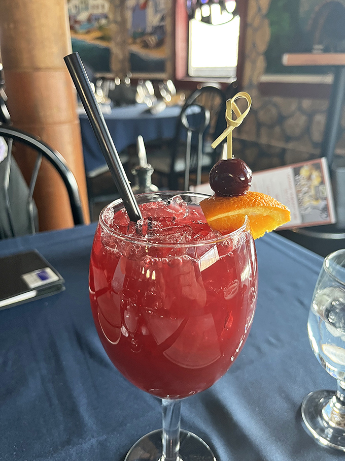 A sangria so vibrant it looks like it's auditioning for a starring role in your vacation memories. The cherry and orange slice seal the deal.