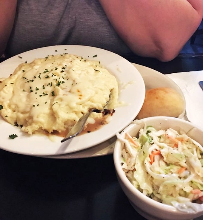 Comfort on a plate &ndash; creamy potatoes cascading over savory filling with a side of coleslaw for crunch. A meal that hugs you from the inside out.