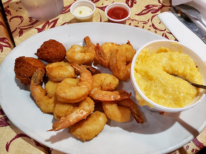 These plump shrimp nestled against creamy cheese grits might be the most beautiful marriage in Georgia. The hushpuppies are just there to witness the magic.
