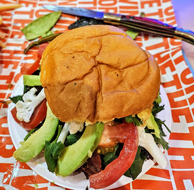 This isn't just a burger with toppings—it's architecture, it's art, it's everything California in one glorious handful.