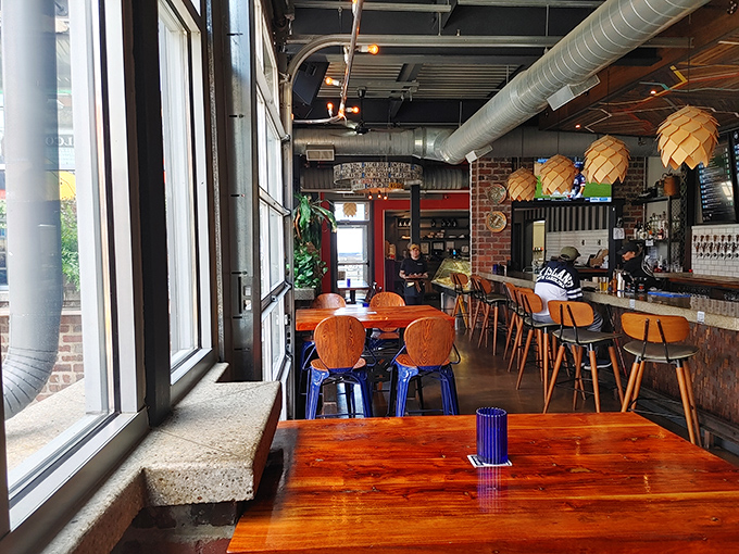 Sunlight streams through windows illuminating wooden tables where conversations flow as freely as the German beer from those gleaming taps.