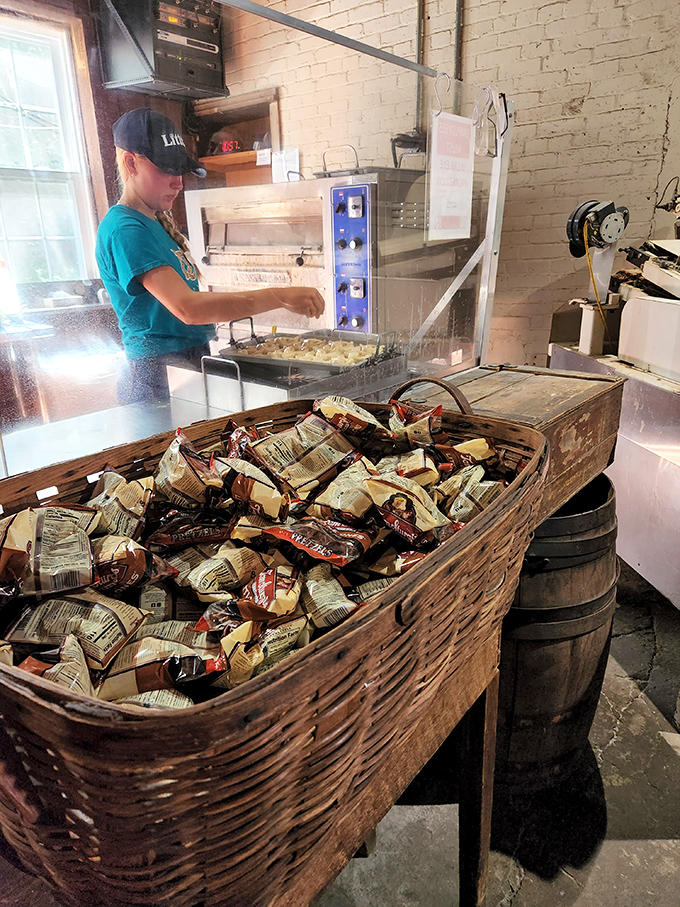Modern equipment meets traditional methods as staff prepare the day's offerings. That wooden basket of packaged pretzels is basically a treasure chest.