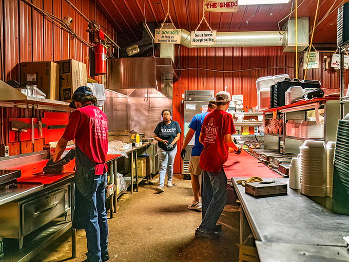 The kitchen crew &ndash; BBQ's unsung heroes working their smoky magic while the rest of us just show up and take all the delicious credit.