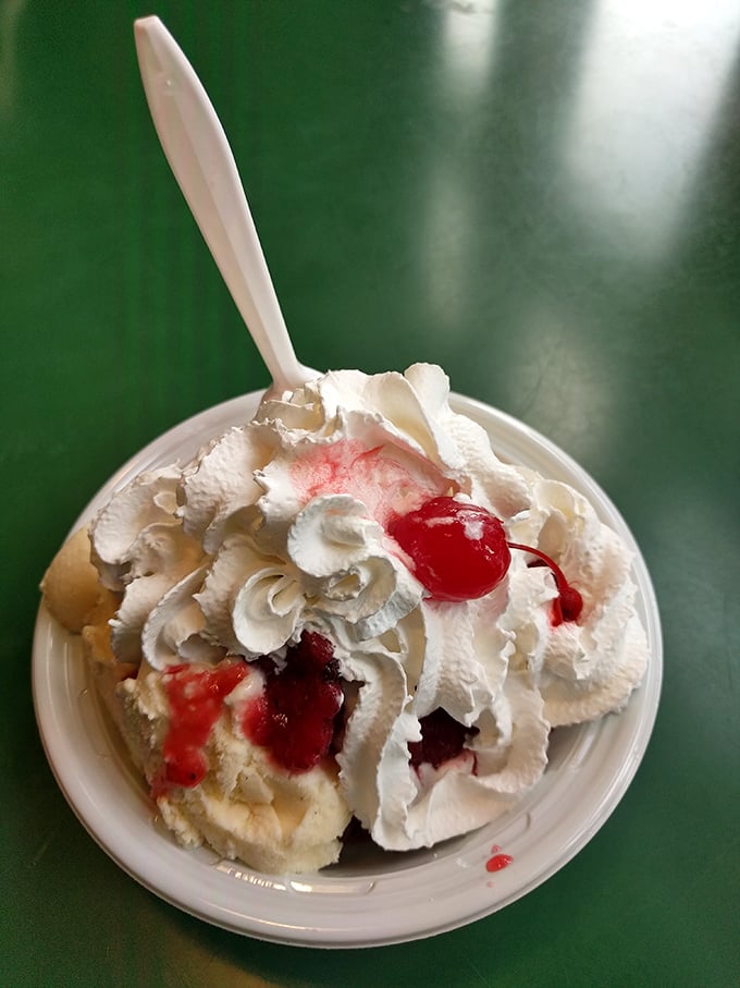 This sundae isn't just dessert, it's performance art &ndash; layers of vanilla ice cream, strawberry sauce, and whipped cream creating a masterpiece in a bowl. 