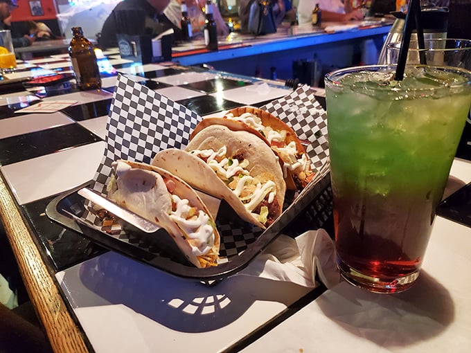Tacos and a technicolor drink that looks like it was mixed by a mad scientist with excellent taste in both food and beverages.