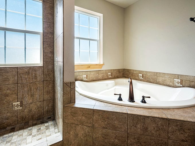 The royal bathroom combines luxury and practicality with its spacious soaking tub and walk-in shower&mdash;medieval comfort with decidedly modern plumbing.