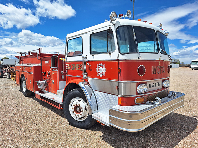 This vintage fire truck stands ready for duty decades after its last alarm. Its red and chrome finish gleams under New Mexico's famous blue skies.