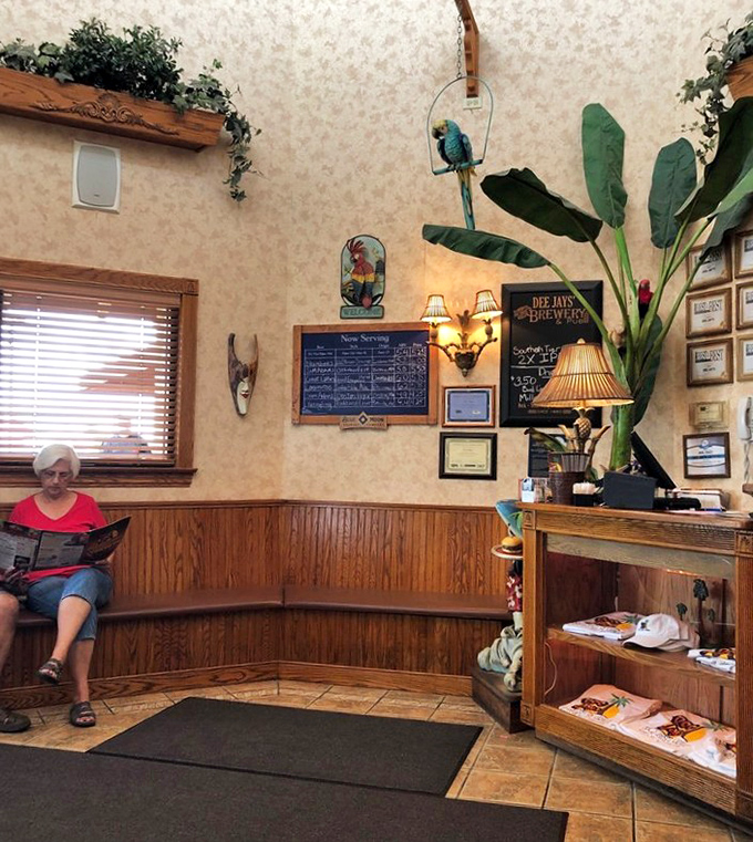 The waiting area, where anticipation builds and menu-studying becomes an Olympic sport. Note the tropical bird keeping watch over hungry patrons.