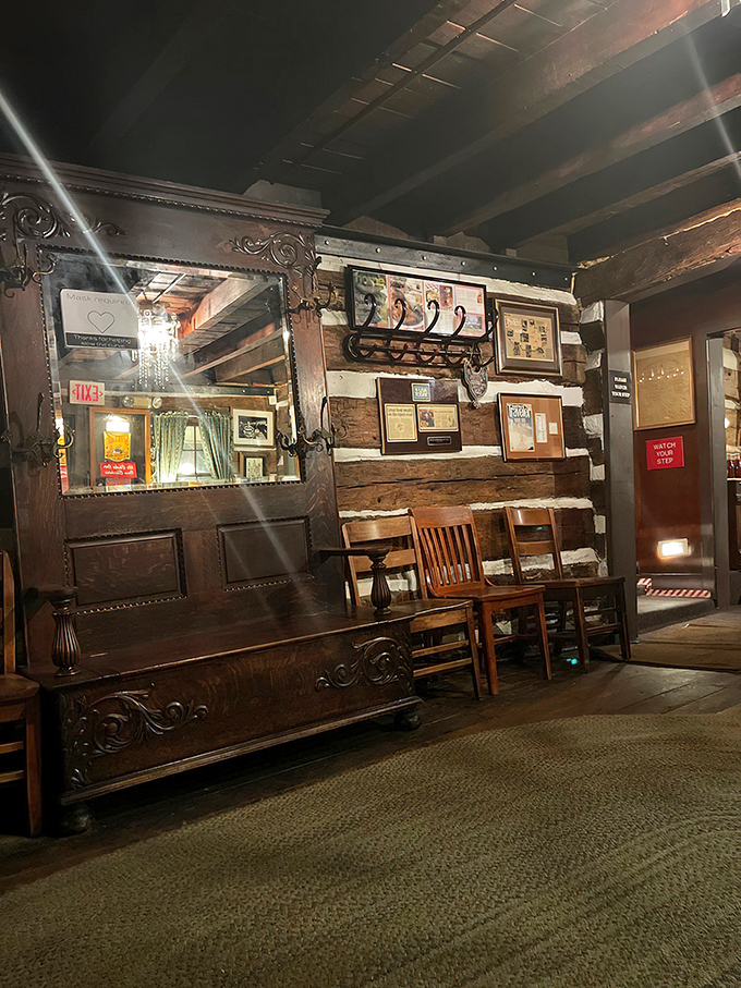 The waiting area's vintage wooden bench and antique mirror aren't just decor&mdash;they're silent witnesses to decades of pre-dinner anticipation and post-meal satisfaction.
