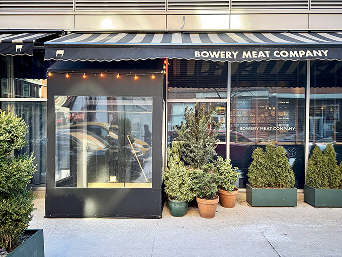 Bowery Meat Company's sleek black exterior and tidy plantings whisper of urban sophistication and meticulously sourced beef.