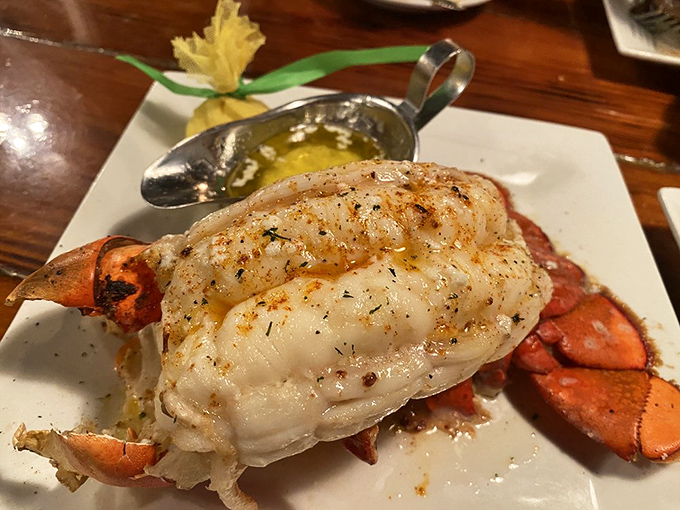 This isn't just a lobster tail&mdash;it's Neptune's gift to landlubbers. The tender meat practically glows with buttery promise on its pristine plate.