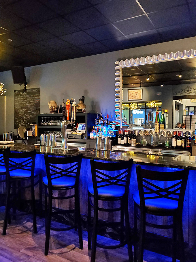 Under cool blue lighting, this bar beckons with the promise of ouzo, wine, and conversations that might just solve the world's problems.