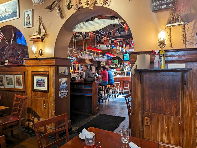 The bar beckons through a nautical archway, promising libations that would make even the most seasoned sailor say "ahoy" with delight.