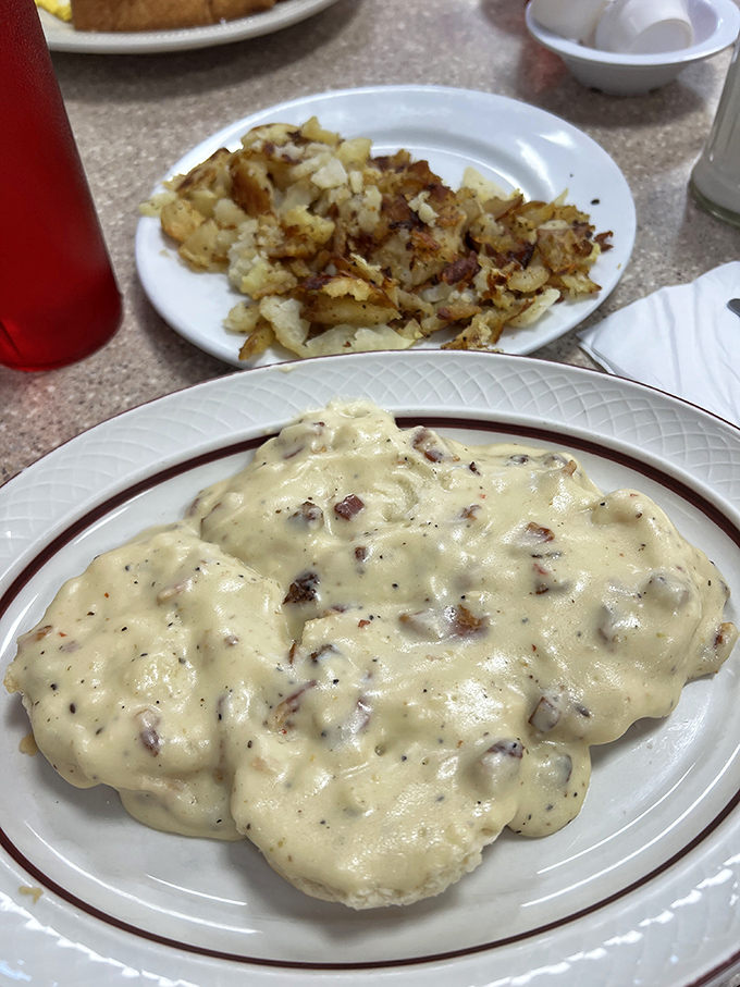 Biscuits and gravy: the Southern comfort duo that's creamier than Elvis's hair and more satisfying than hitting the jackpot. It's a plate of pure, unadulterated breakfast bliss.