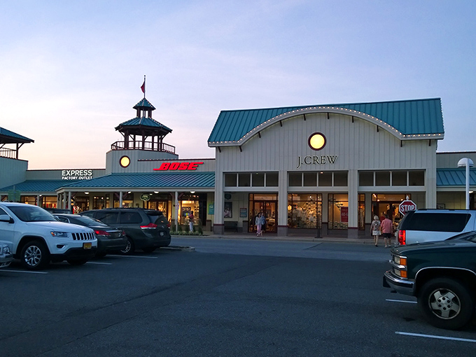 Twilight at Tanger transforms the outlets into a magical shopping kingdom. J.Crew and Bose beckon with their warm, glowing storefronts.