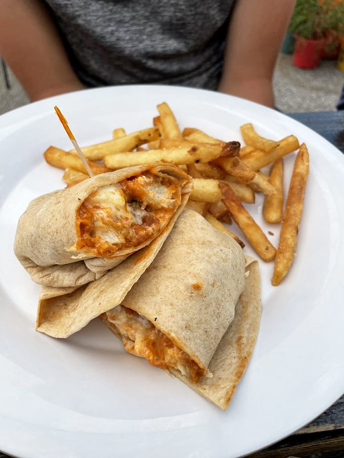 Buffalo chicken wrap: proof that lunch can be just as exciting as breakfast. Those golden fries are standing by, ready to complete your midday happiness equation.