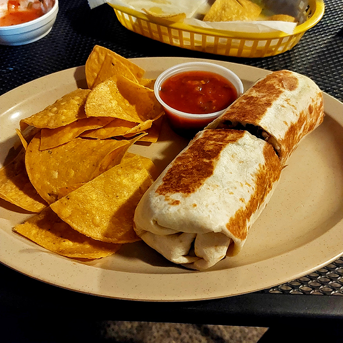 The burrito, tortilla chips, and salsa&mdash;a holy trinity of satisfaction. Simple pleasures executed with the precision of a culinary symphony. 