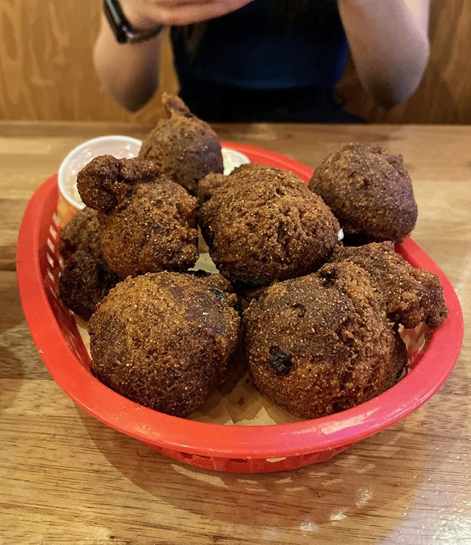 Hushpuppies: the South's greatest contribution to civilization after blues music. These golden orbs of cornmeal joy demand respectful silence.