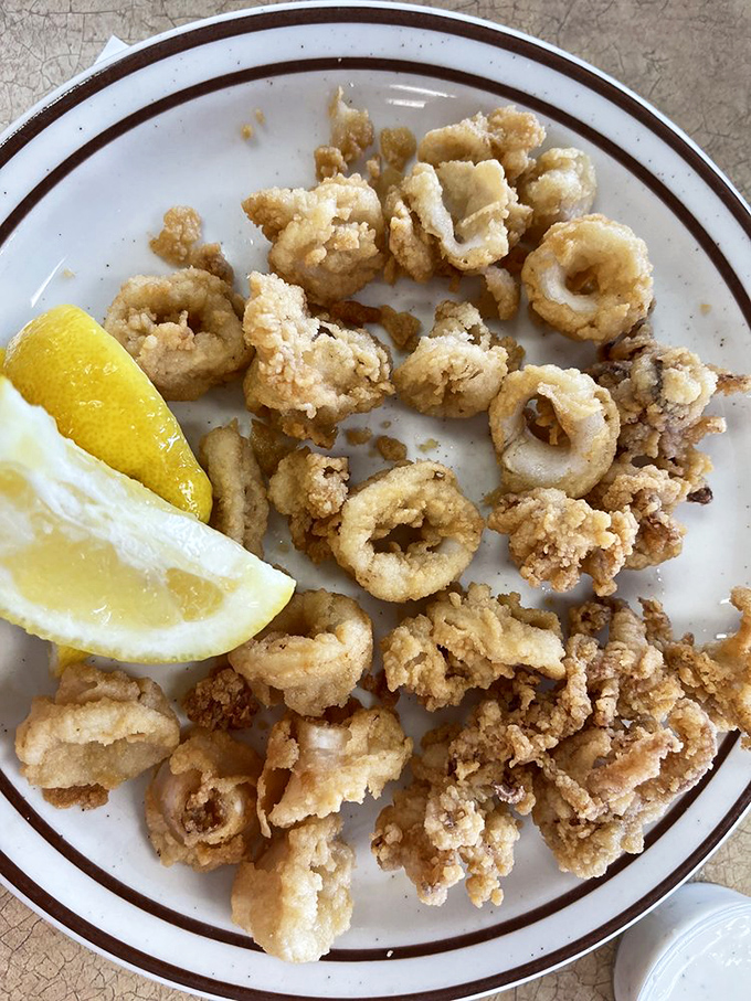 Calamari so perfectly fried it makes you wonder why anyone bothers with complicated cooking when simplicity tastes this good.
