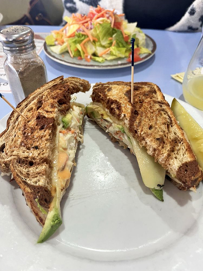 This melt reveals its gooey interior like a cheesy sunset. The perfect marriage of crispy bread and creamy filling deserves its own romance novel.