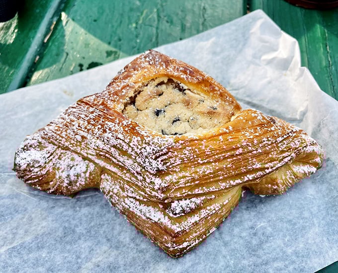 This apple danish against autumn leaves creates a seasonal harmony that would make even the Grinch order seconds.