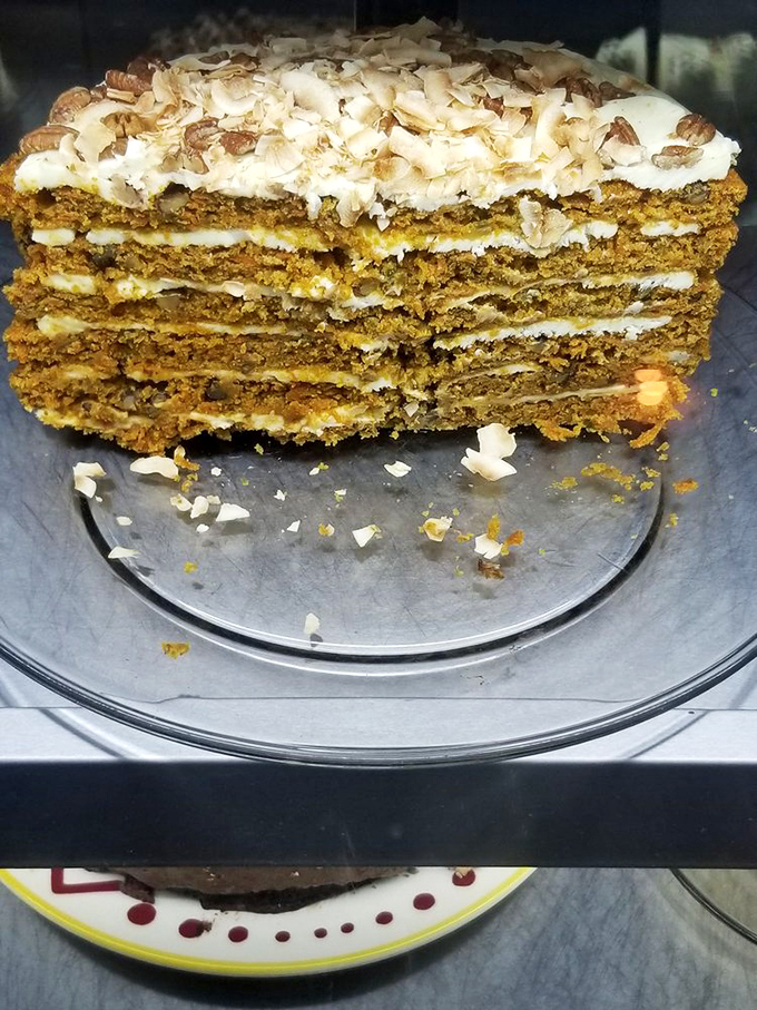 This carrot cake has more layers than a German opera. Each forkful delivers a perfect harmony of spice, cream, and nutty crunch.