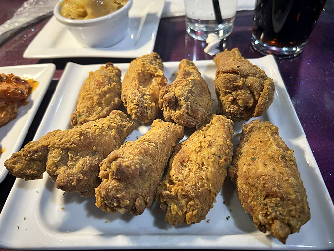 Perfectly seasoned fried chicken wings with a crust so crisp it practically serenades you. The accompanying sauce cup is just showing off at this point.