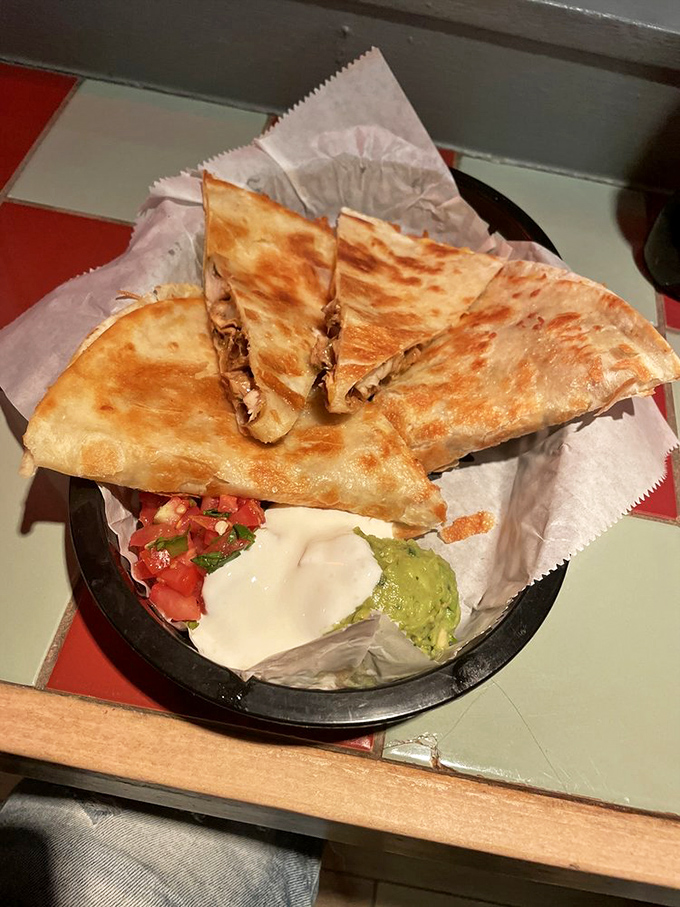 Quesadillas done right&mdash;crispy exterior, molten interior, with accompaniments that aren't afterthoughts but essential supporting characters.
