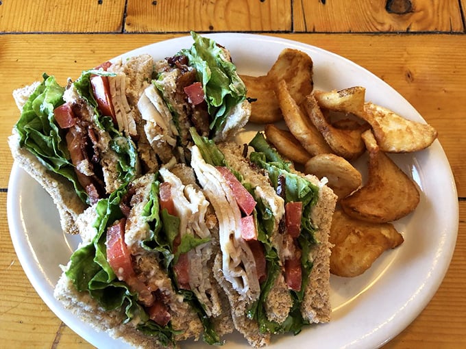 A club sandwich that requires jaw exercises beforehand, stacked higher than weekend expectations and twice as satisfying.