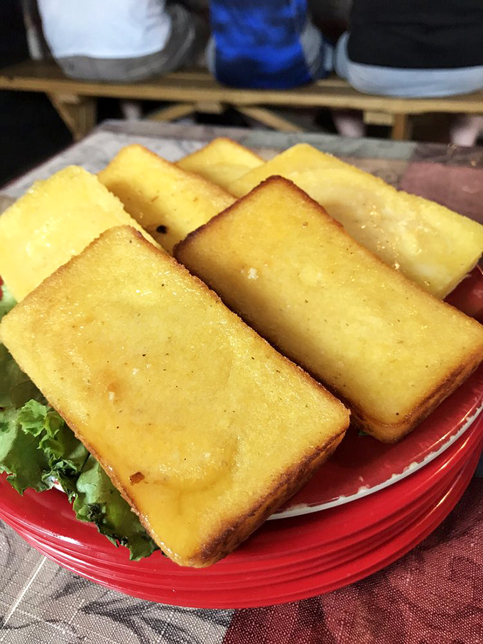 Golden cornbread squares offer the perfect vehicle for soaking up every last drop of sauce.