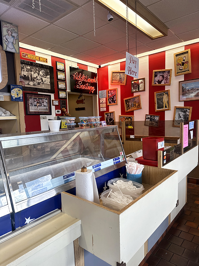 The display case&mdash;where dreams are kept at precisely 10 degrees Fahrenheit. That neon "Additional Seating" sign is really just saying "Stay Awhile."
