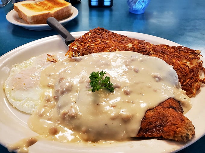 Country fried steak smothered in gravy&mdash;when your arteries say "no" but your soul screams "absolutely yes!"