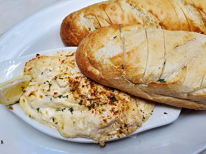 This crab dip isn't just an appetizer—it's a Maryland tradition served hot, bubbling, and ready to convince you that sharing is highly overrated.