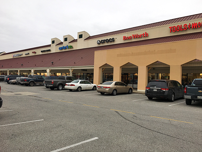 A lineup of diverse storefronts including Crocs and Roc Worth. The architectural equivalent of "something for everyone."