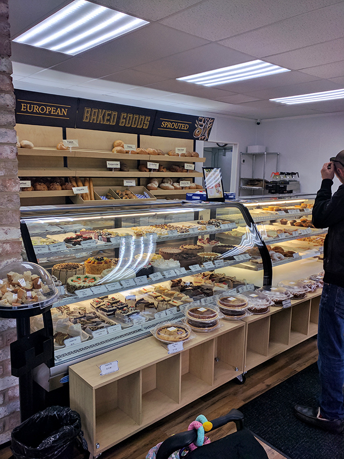 The European bakery experience includes shelves of fresh-baked breads and a display case that makes choosing just one item nearly impossible.