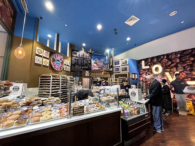 The universal language of donuts brings strangers together. That contemplative pause at the counter? It's the weight of delicious responsibility.
