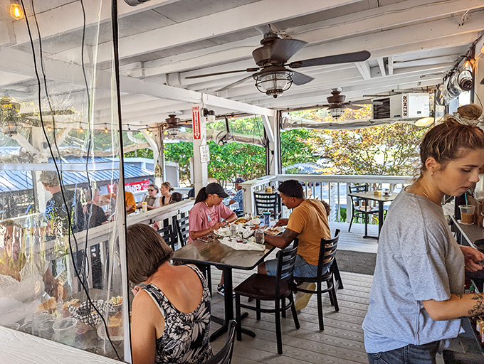 The covered porch offers al fresco dining with a side of people-watching. Southern hospitality extends to the very edges of the property.