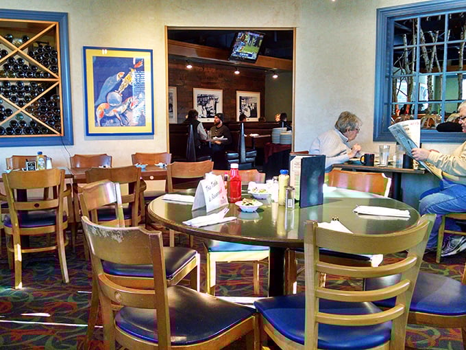 The dining room hums with conversation and clinking silverware. These tables have witnessed countless family celebrations and friendly debates.