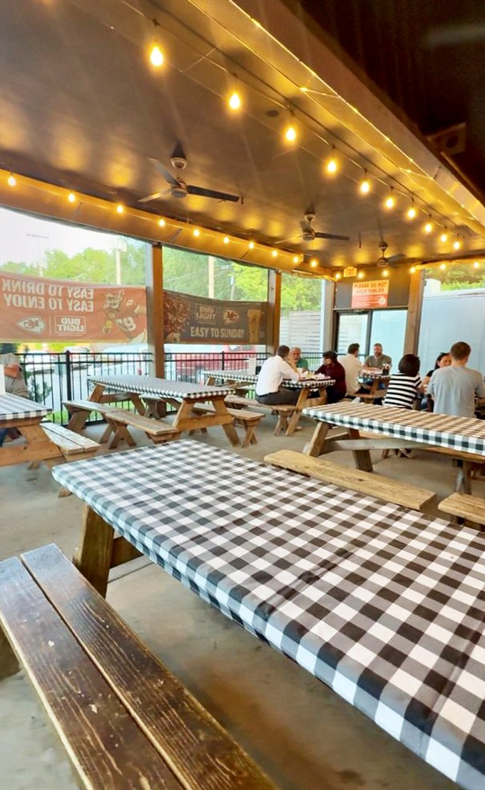 The outdoor seating area&mdash;where checkered tablecloths and string lights transform a simple meal into a backyard celebration.
