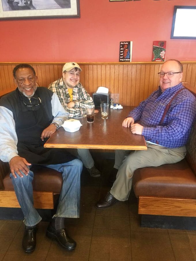 Happy diners sharing stories and laughter over soul food. This is what restaurants were invented for in the first place.
