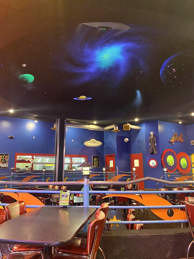 Look up! The ceiling's swirling galaxy and hanging planets create the perfect atmosphere for contemplating the universe while devouring barbecue.