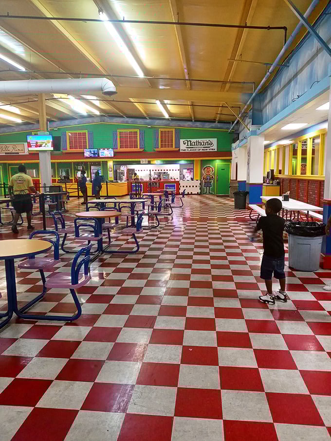 Nathan's hot dogs and classic diner decor create the perfect refueling station. That red and white checkered floor practically demands a between-rides milkshake break.