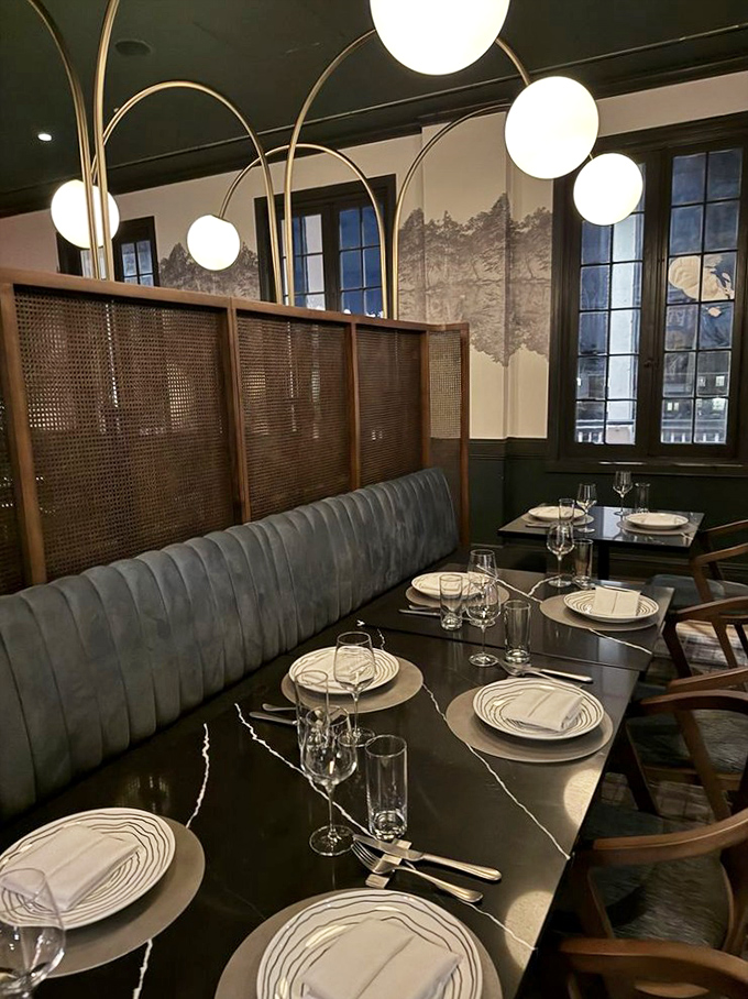 Elegant place settings await their starring role in your evening's memory. Those curved chairs practically whisper "stay awhile."